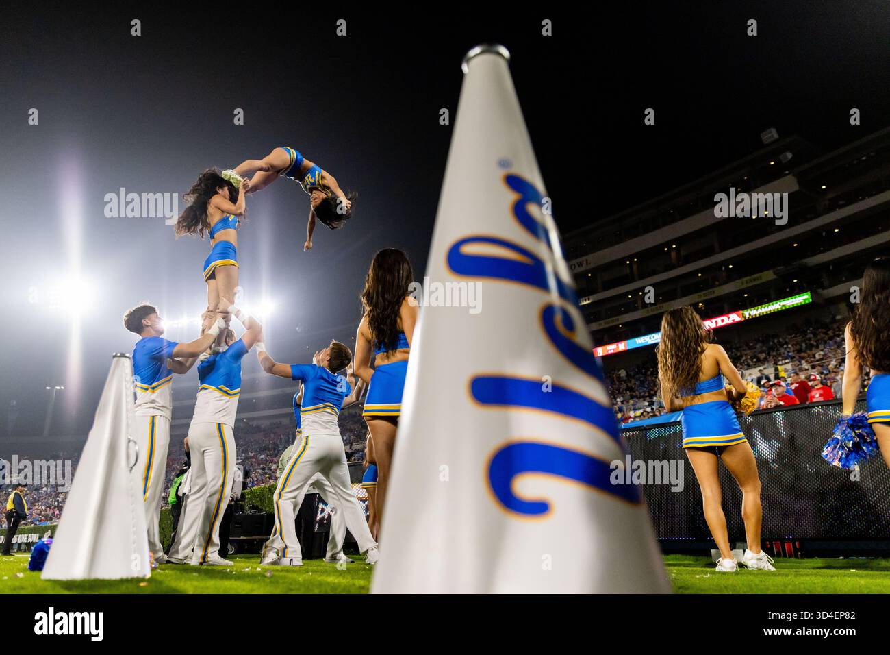 The UCLA cheer team perform during the second half of an NCAA college ...