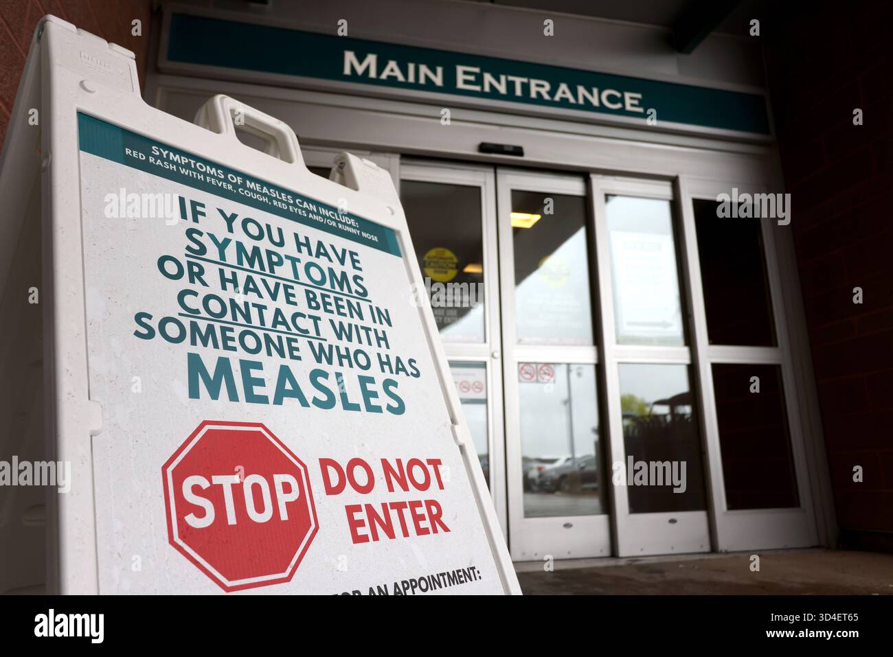 Warning signage for suspected cases of measles is seen outside the main ...