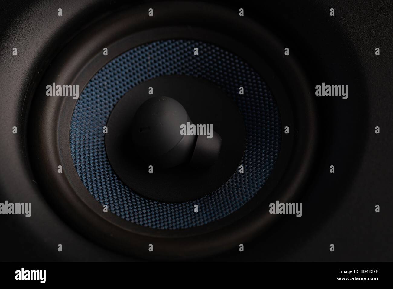 Close Up Wireless Earbuds Resting Inside Speaker Woofer Stock Photo - Alamy