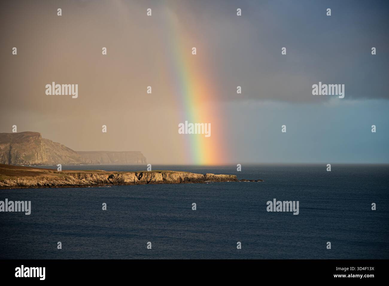 A rainbow disappearing into the sea at Gulberwick Shetland Stock Photo ...