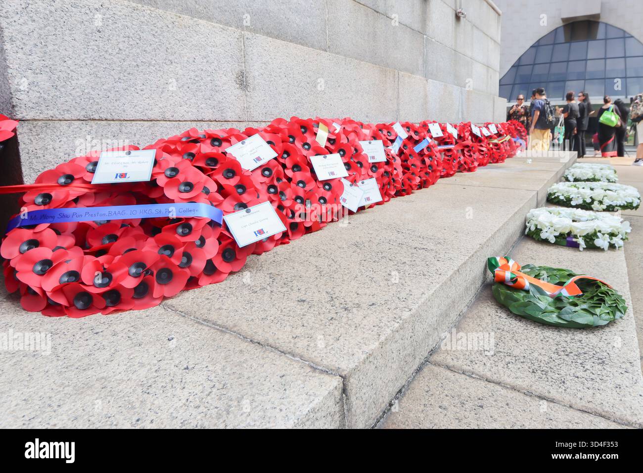 Remembrance flower circles laying at the Cenotaph during an event to ...