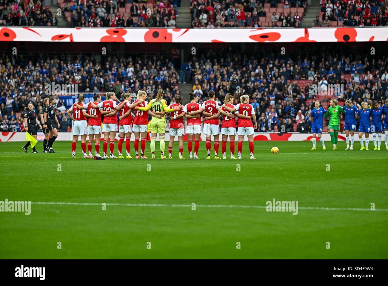 Match officials and players of Arsenal and Chelsea, stand for a minutes ...