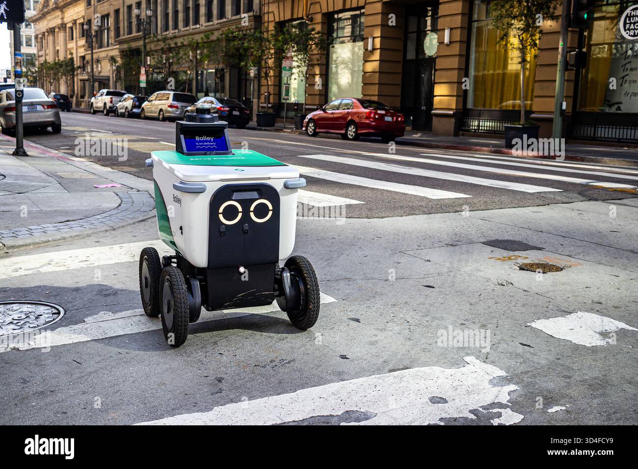 Delivery robot crossing the street, autonomous sidewalk delivery robot ...