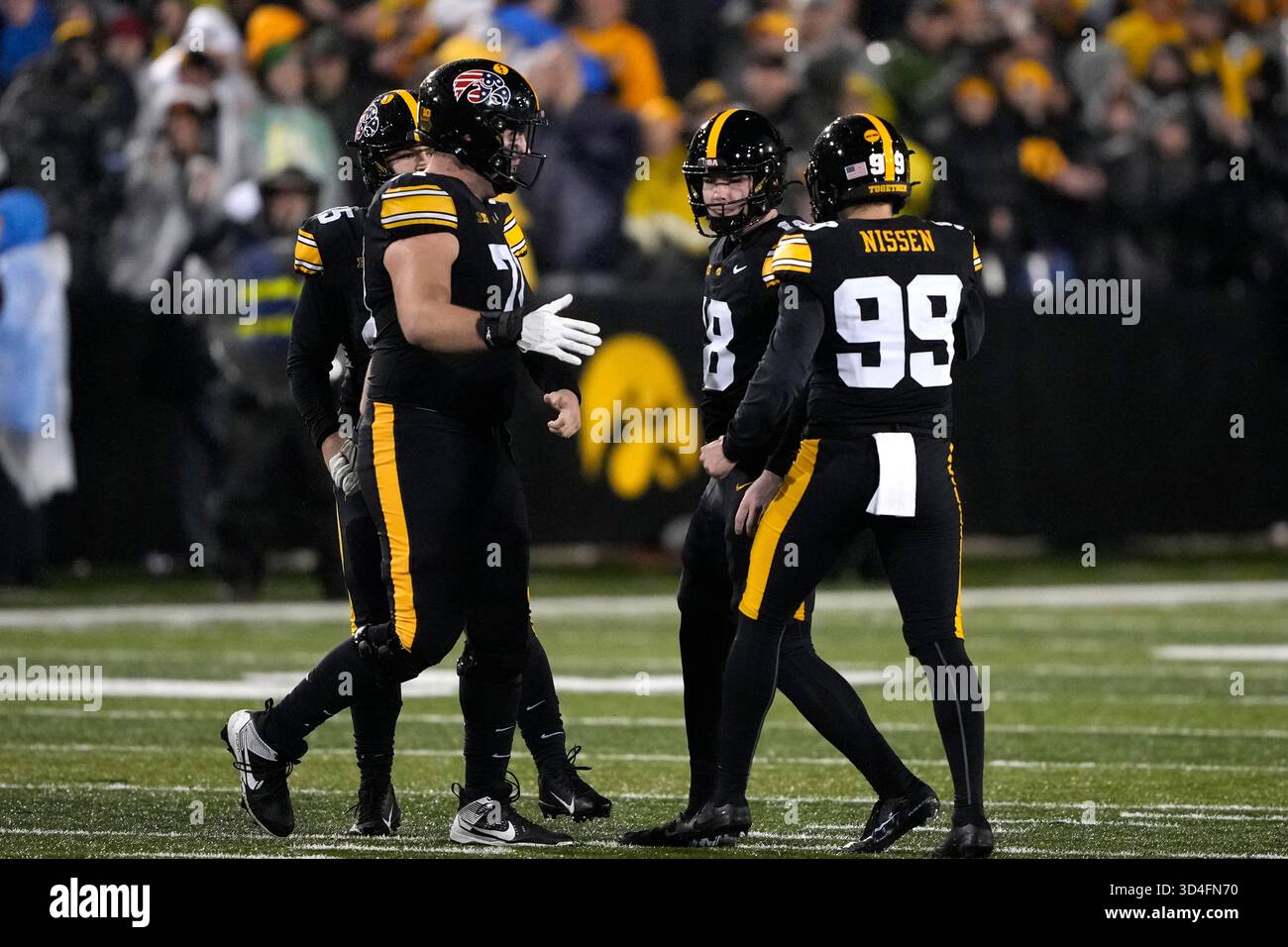 Iowa kicker Drew Stevens (18) celebrates with teammates after kicking a ...