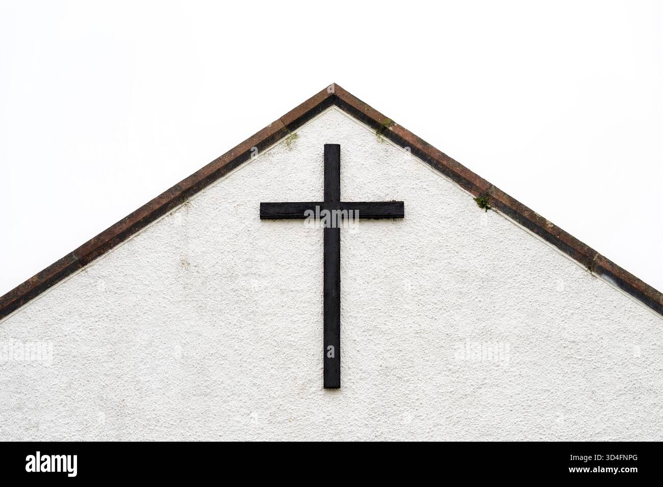 Christian cross on a church gable, UK Stock Photo - Alamy