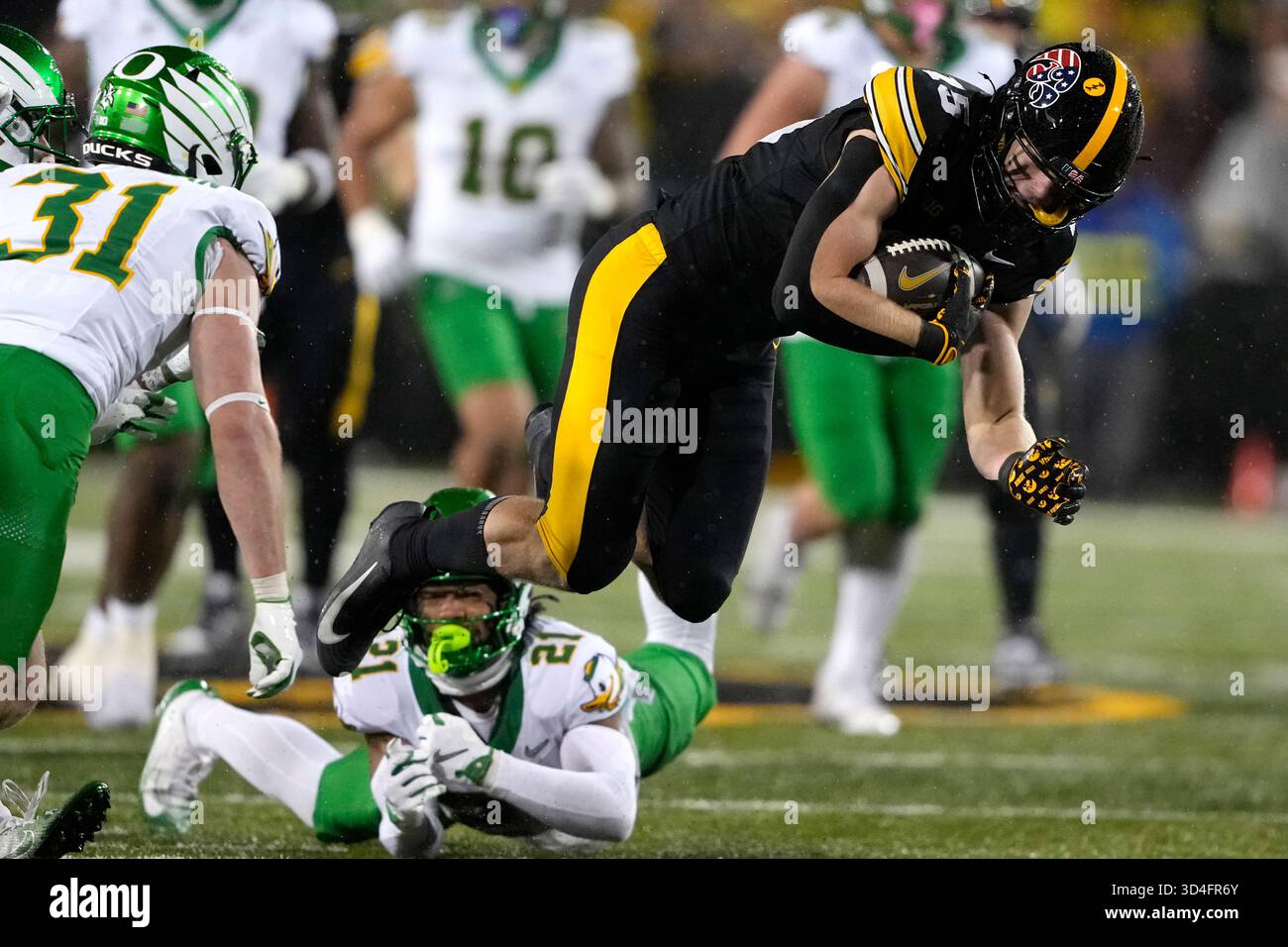 Iowa wide receiver Reece Vander Zee (15) is tackled by Oregon defensive ...