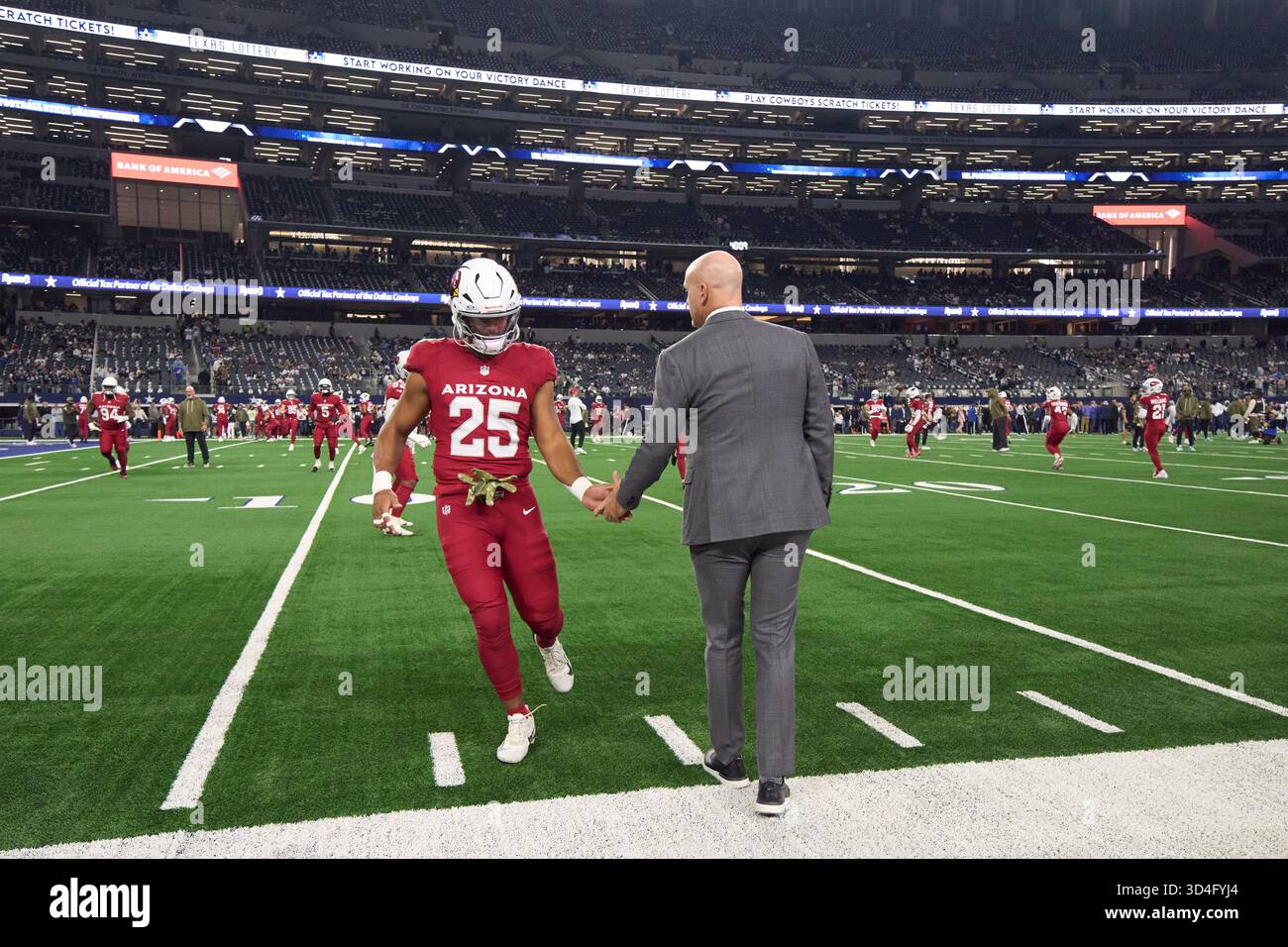 Arizona Cardinals linebacker Zaven Collins (25) greets general manager ...