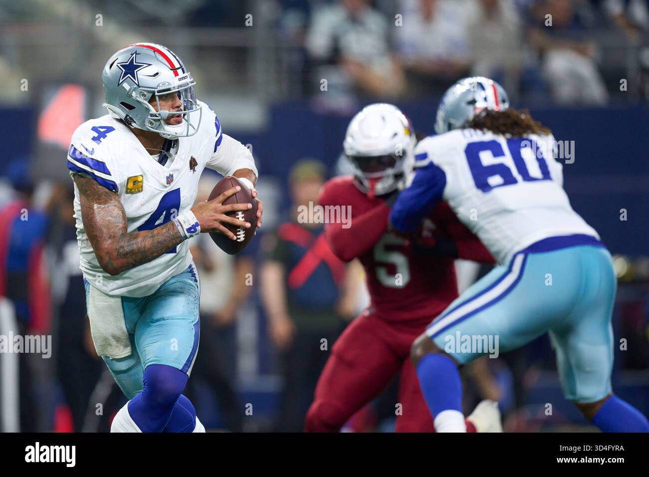 Dallas Cowboys quarterback Dak Prescott (4) runs a play during an NFL ...