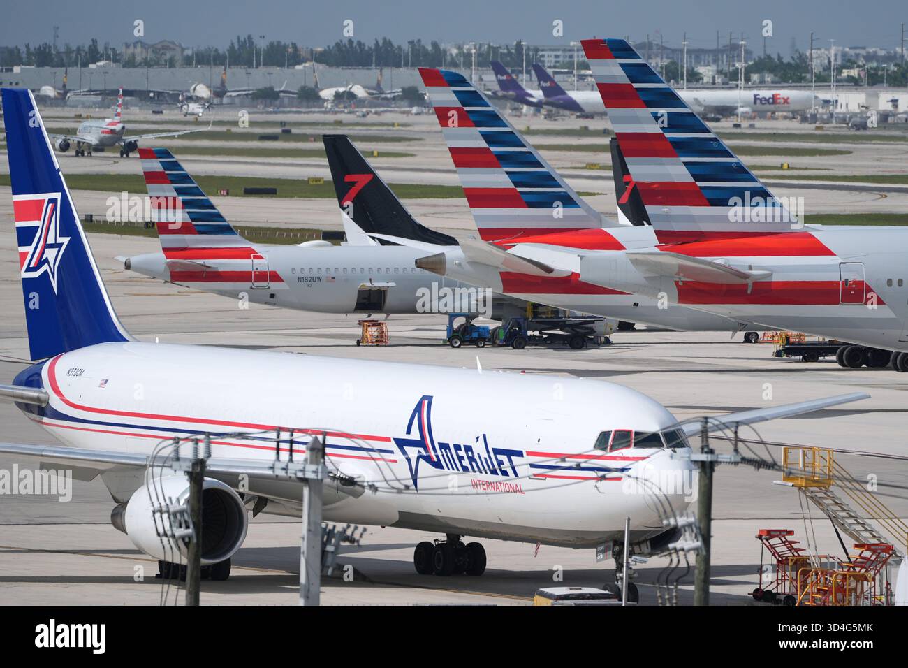 Jets sit parked on the tarmac at Miami International Airport, Monday ...