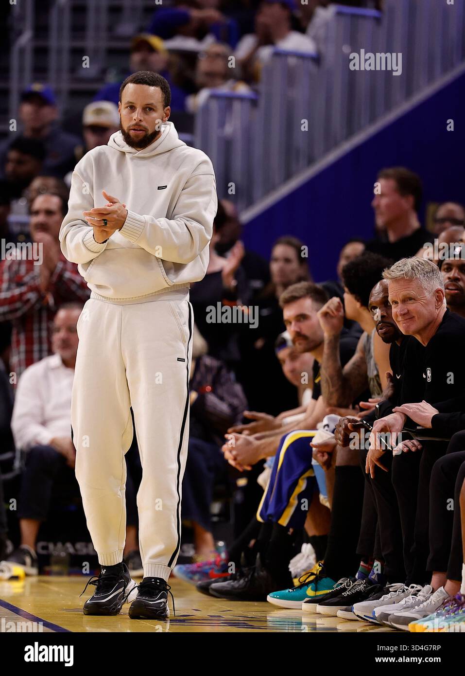 Golden State Warriors guard Stephen Curry claps from the bench during ...