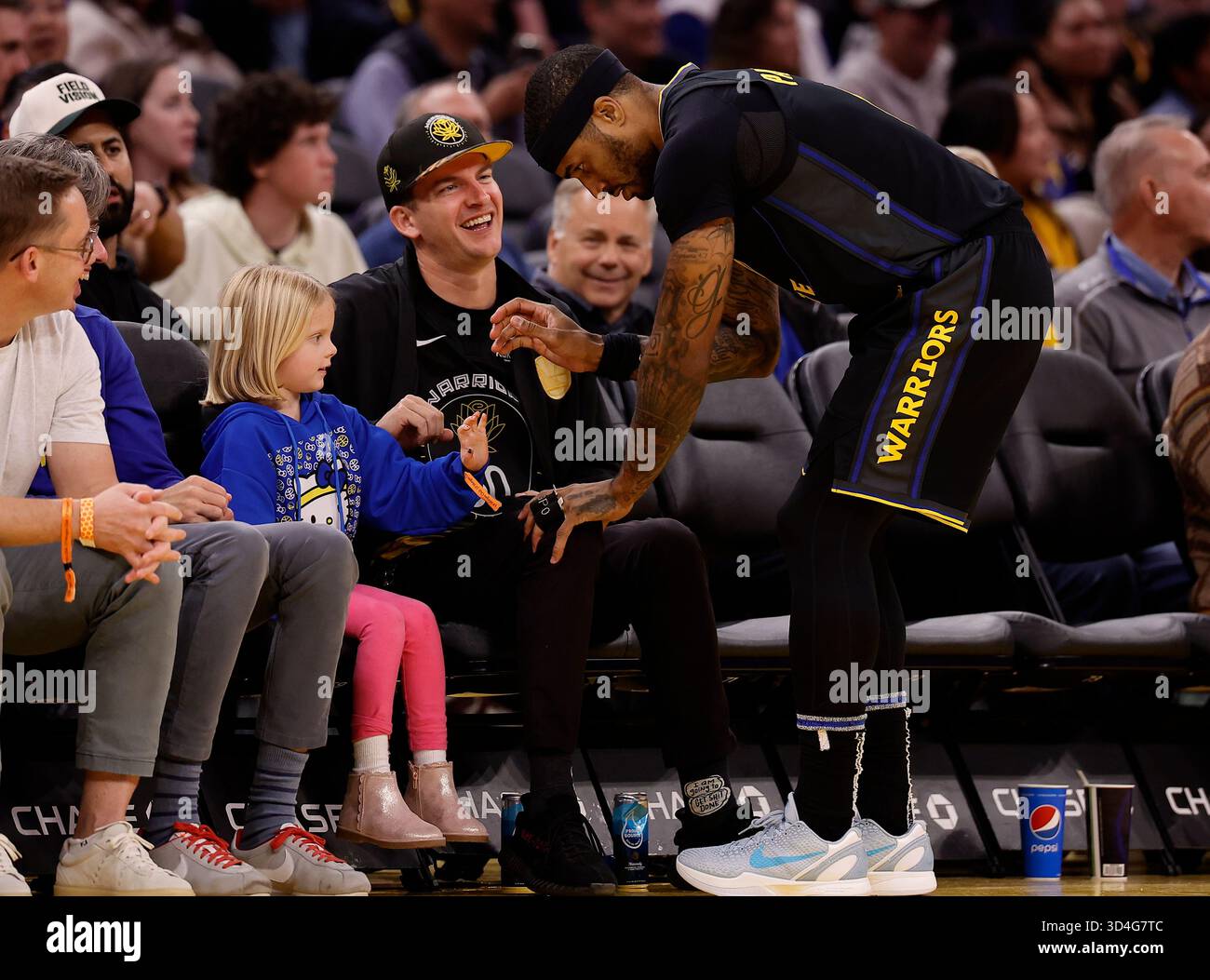 Golden State Warriors guard Gary Payton II interacts with a fan during ...
