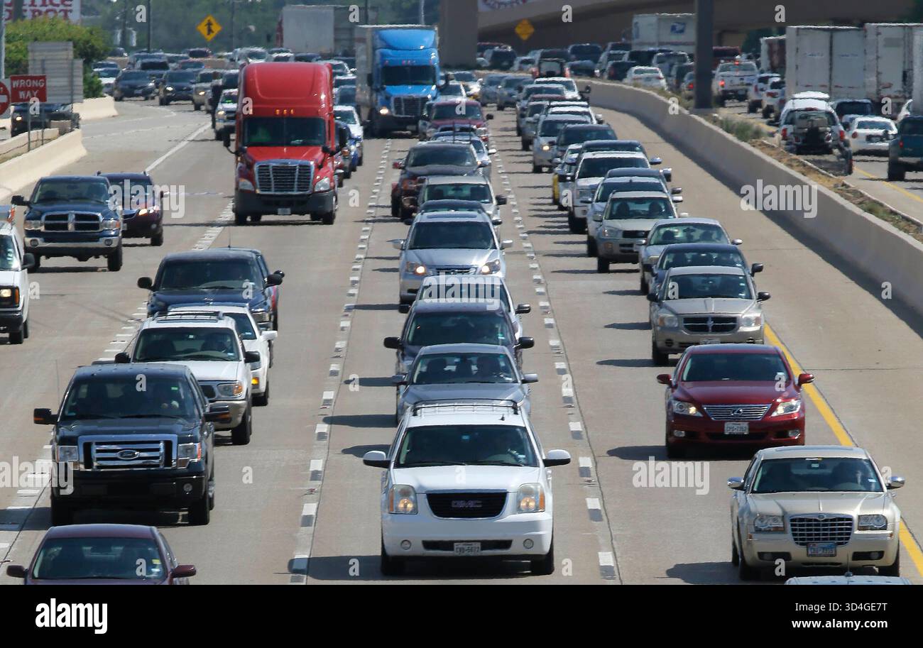 FILE - Drivers work their way out of Dallas during rush hour, on July 1 ...