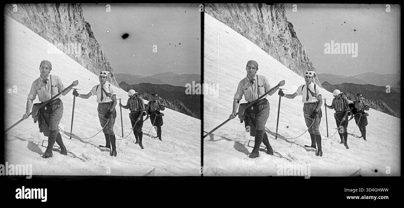 This image shows climbers roped together on a snow-covered slope, taken ...