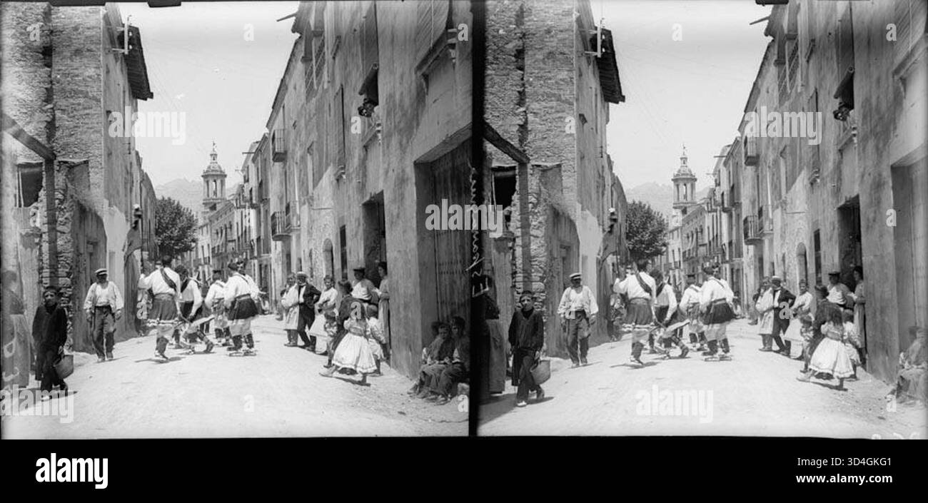 A traditional stick dance and public audience in a street of ...