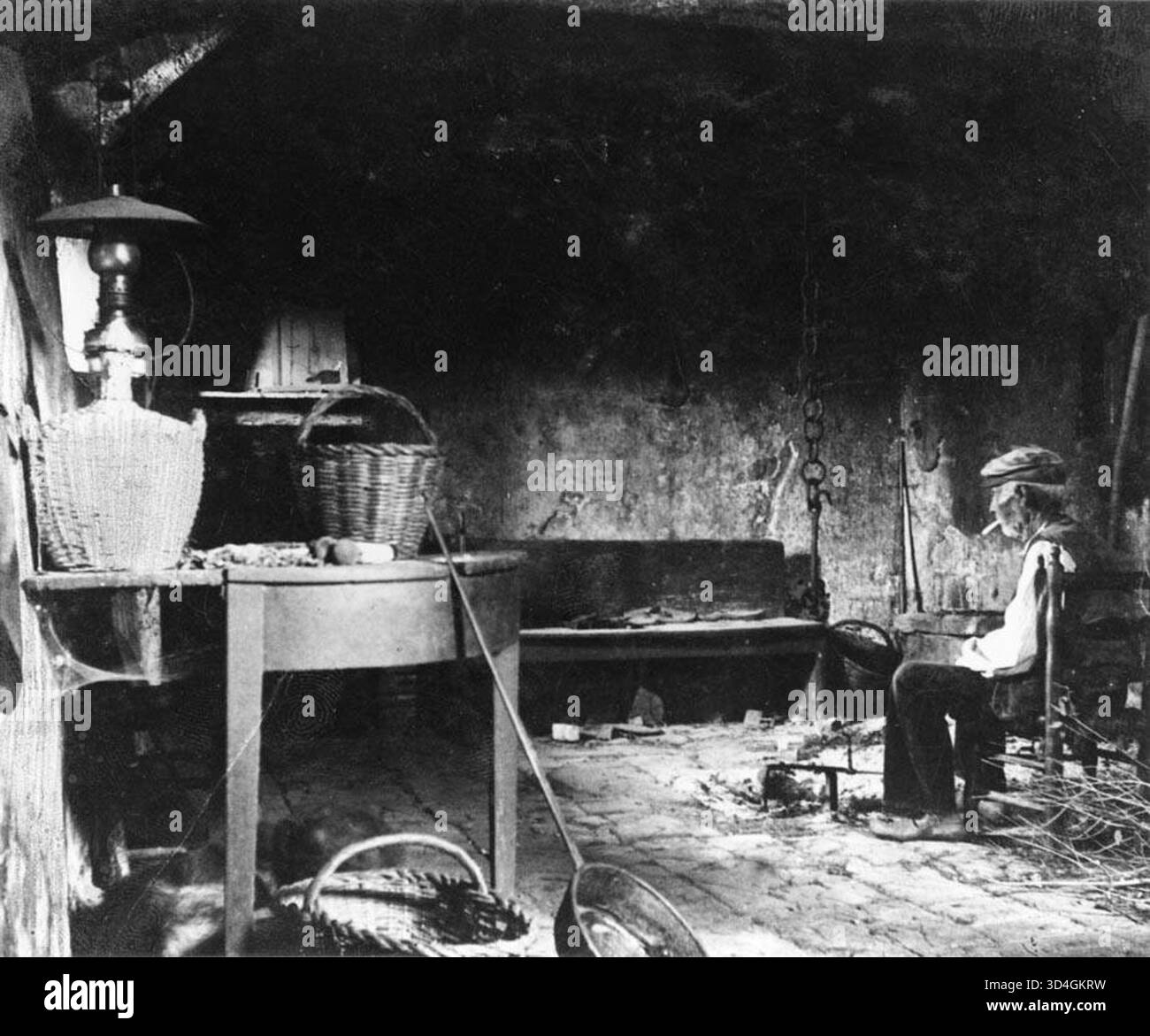 A man inside the kitchen of Can Aymerich at Llerona, photographed by ...