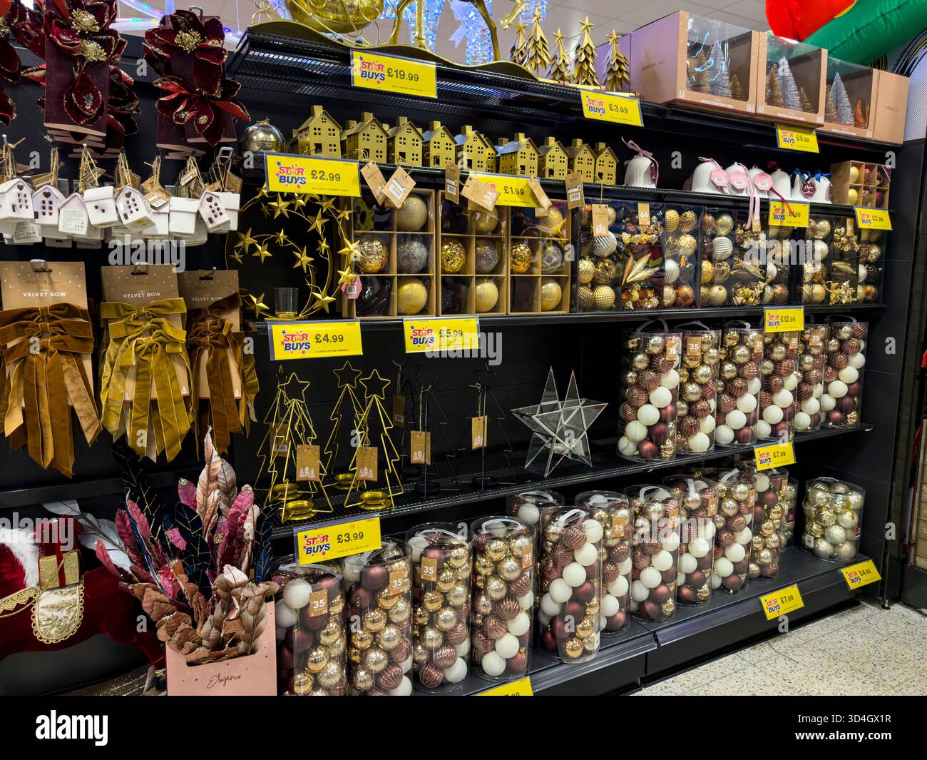 Home Bargains Christmas merchandising aisle with decorations, baubles ...
