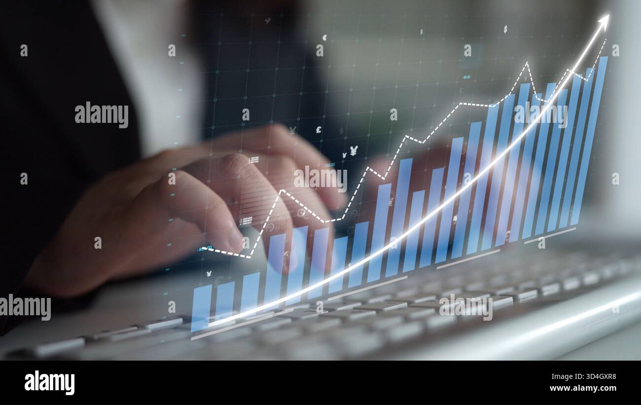 A business professional is engaged in data analysis, with a digital ...