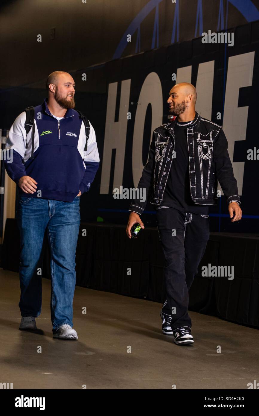 Seattle Seahawks guard Bryce Cabeldue (77) and wide receiver Cody White ...