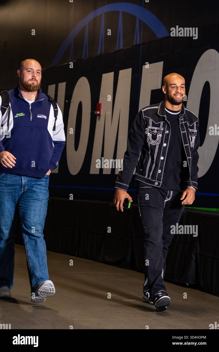 Seattle Seahawks guard Bryce Cabeldue (77) and wide receiver Cody White ...