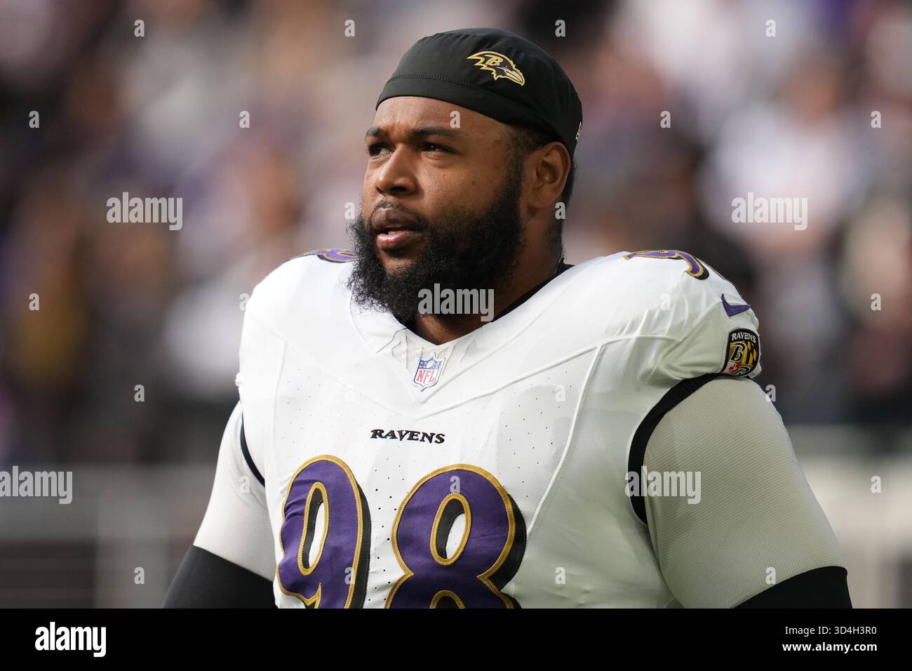 Baltimore Ravens defensive tackle Travis Jones (98) stands on the field ...