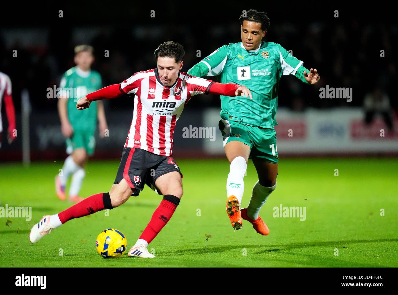 Cheltenham Town's Isaac Hutchinson (left) and Notts County's Tom ...