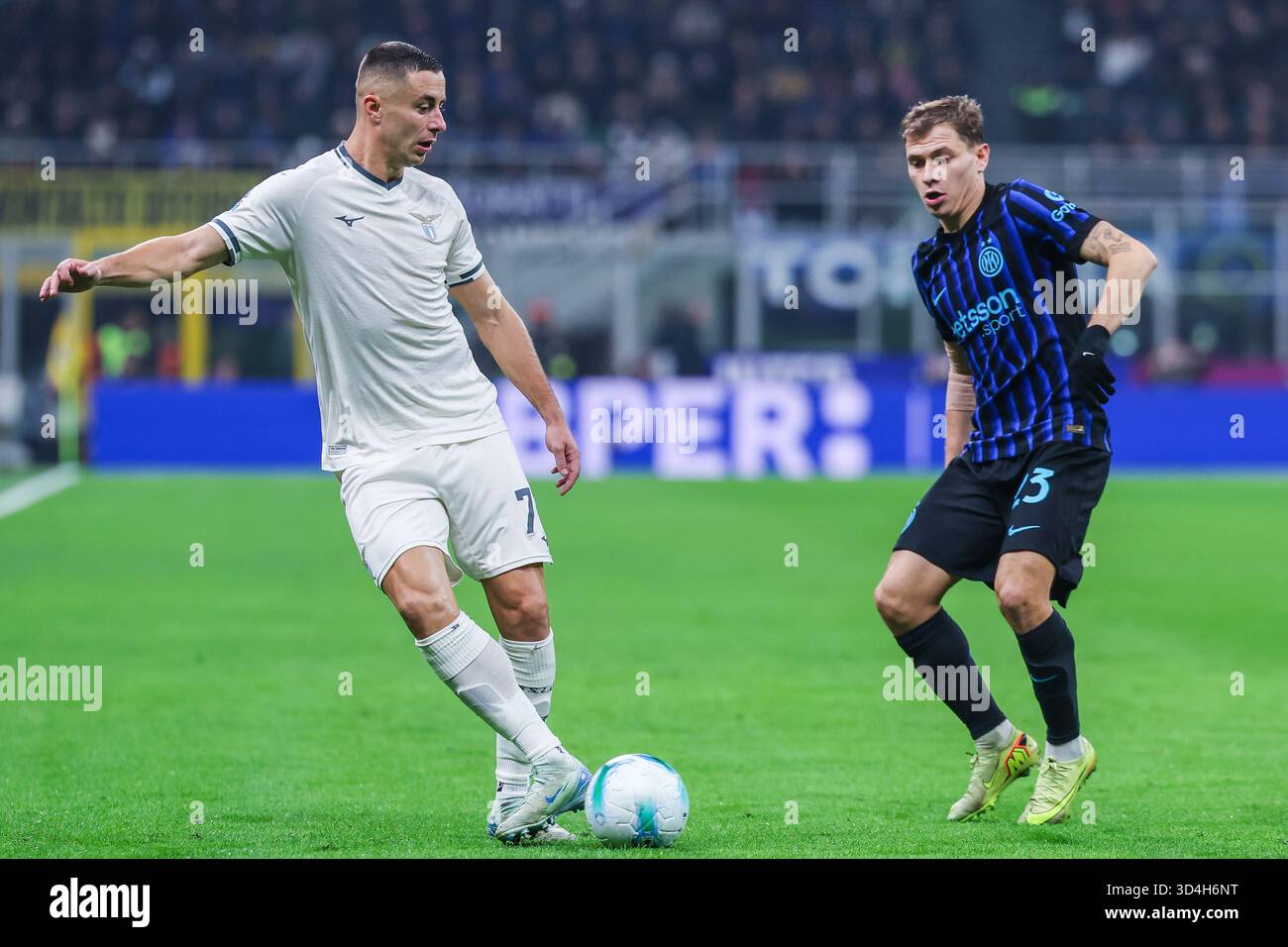 Adam Marusic of SS Lazio competes for the ball with Nicolo Barella of ...