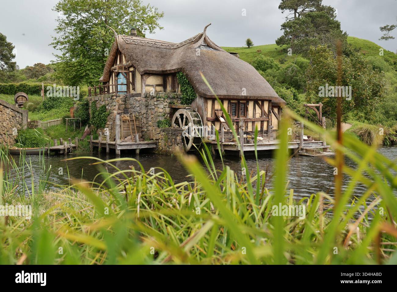Fantasy watermill cottage by lakeside Stock Photo - Alamy