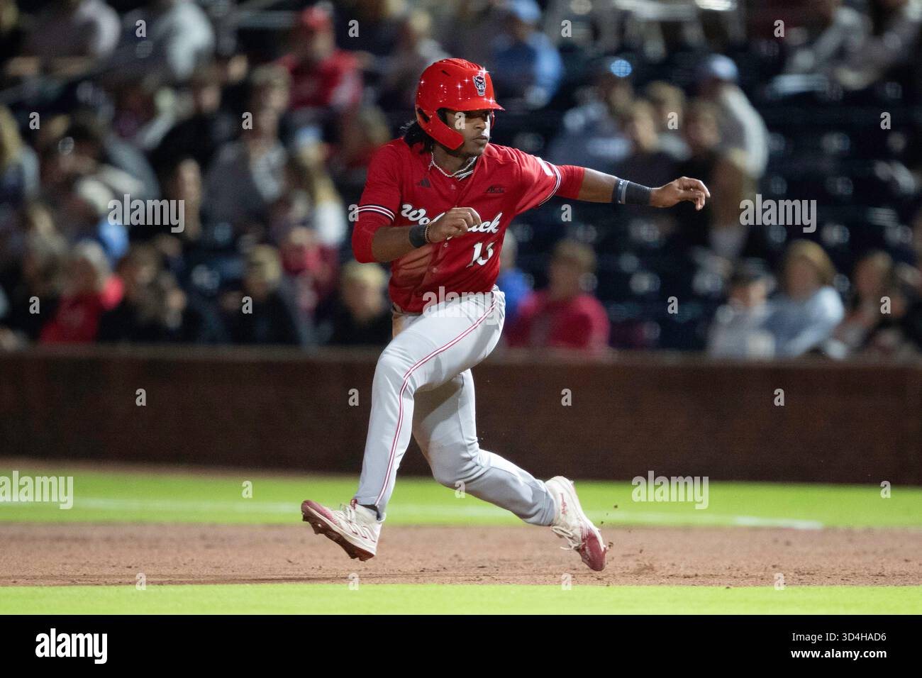 Andrew Wiggins (13) of the NC State Wolfpack runs towards second base ...