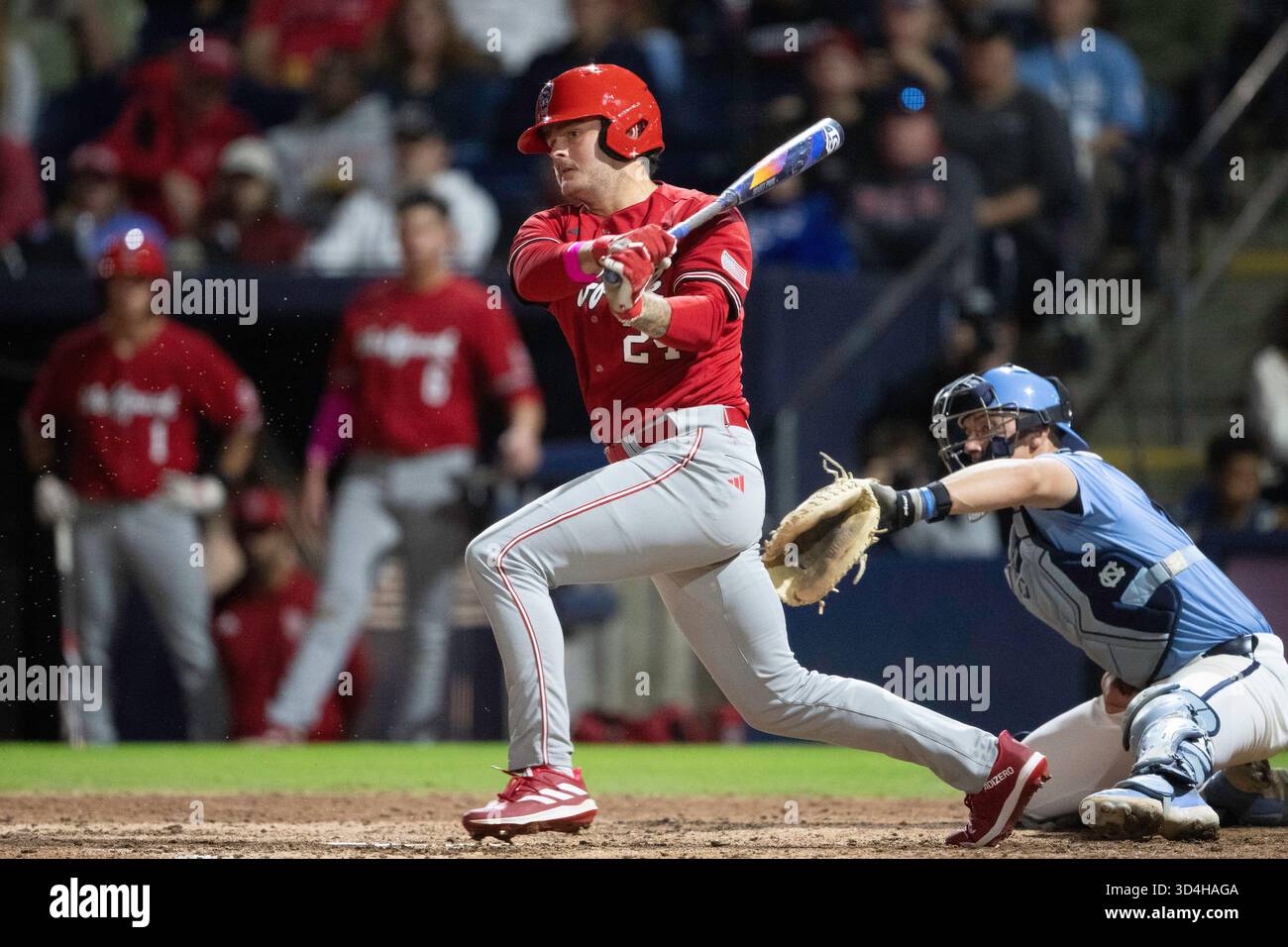 Devin Mitchell (24) of the NC State Wolfpack at bat during an NCAA exhibition baseball game ...