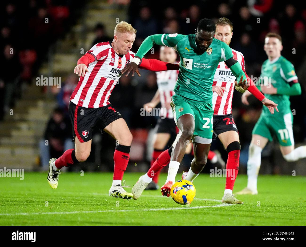 Notts County's Alassana Jatta (right) and Cheltenham Town's Ryan Broom ...