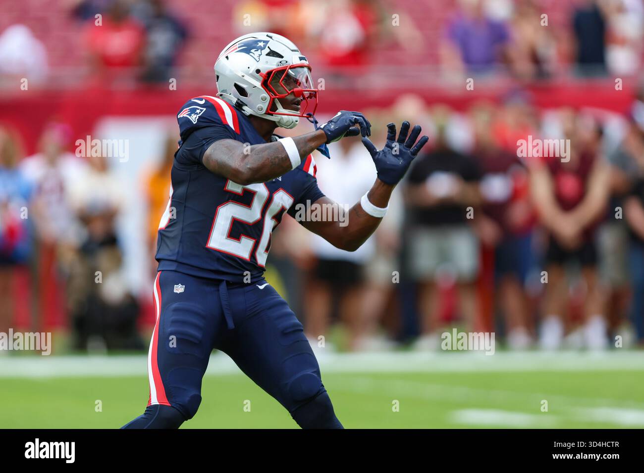 New England Patriots running back Terrell Jennings (26) warms up before ...