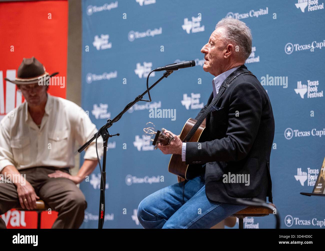 Texas singer songwriter LYLE LOVETT sings while accompanying actor ...