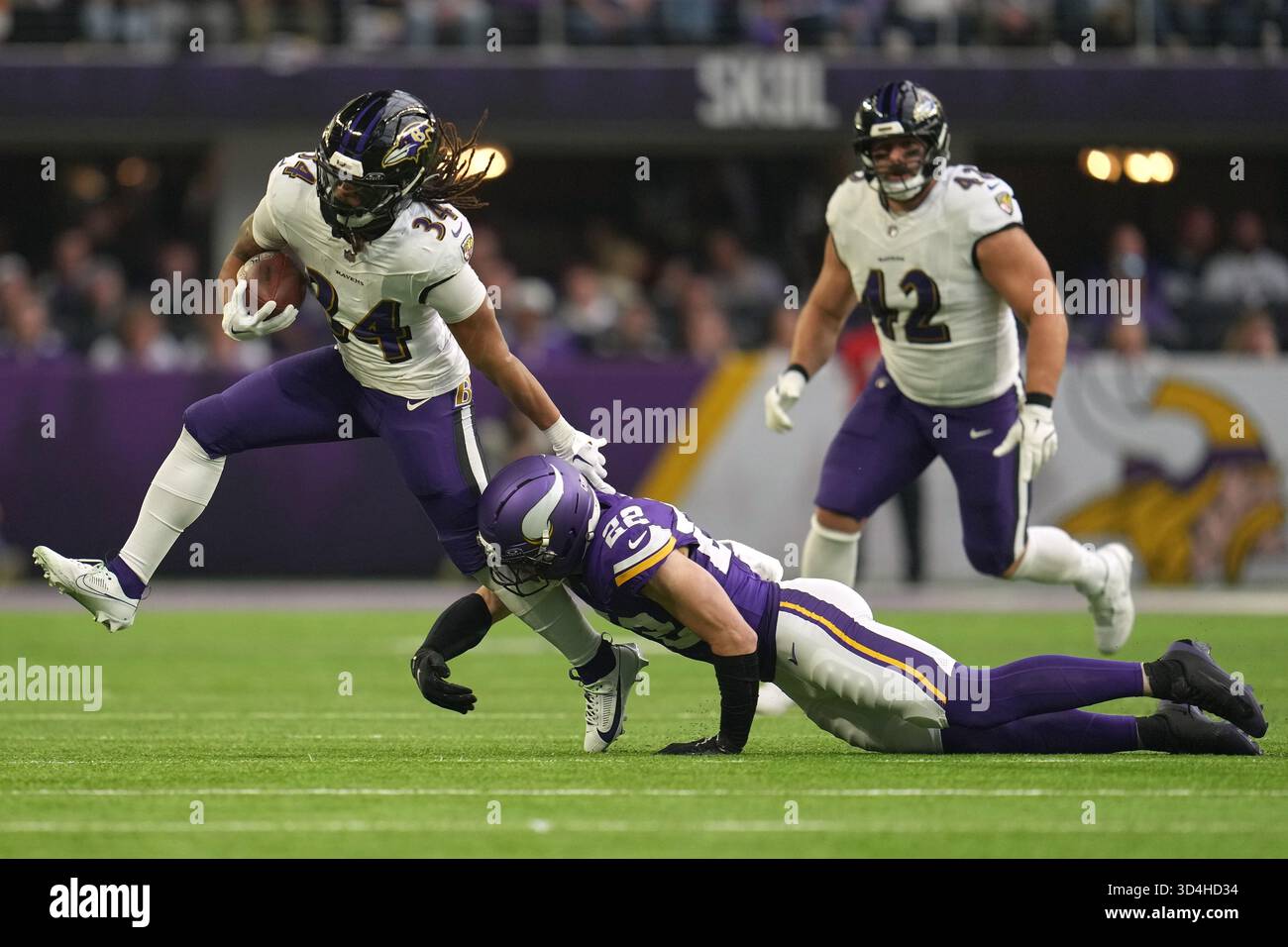 Baltimore Ravens running back Keaton Mitchell (34) is tackled by ...