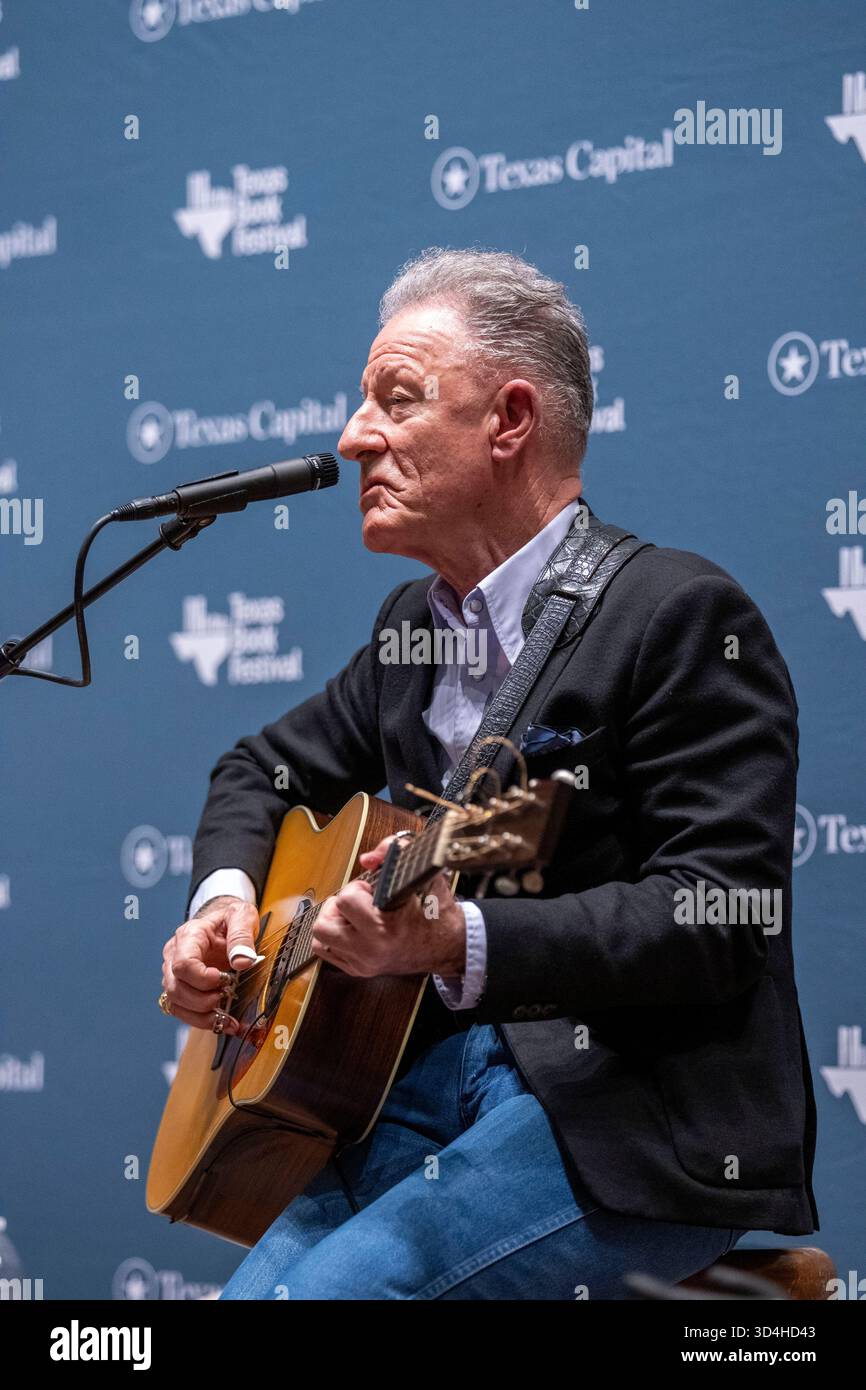 Texas singer songwriter LYLE LOVETT sings while accompanying actor ...