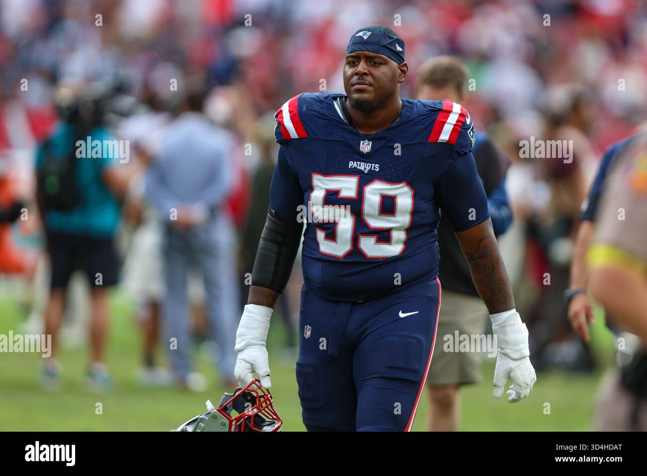 New England Patriots offensive tackle Vederian Lowe (59) leaves the ...