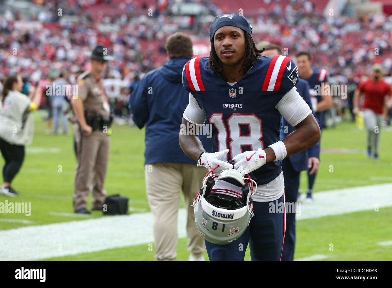 New England Patriots wide receiver Kyle Williams (18) leaves the field after an NFL football ...