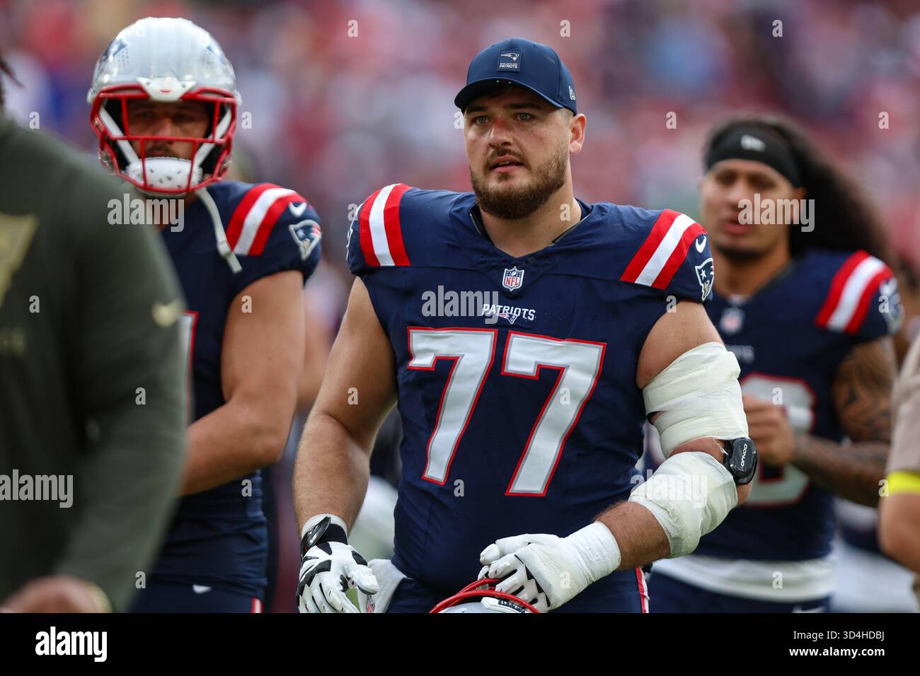 New England Patriots center Ben Brown (77) leaves the field after an ...