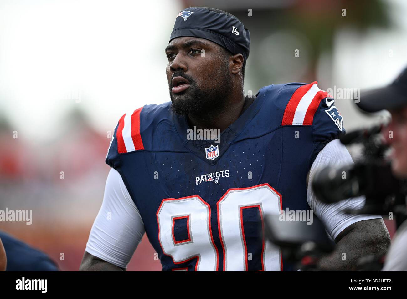New England Patriots defensive tackle Christian Barmore (90) warms up ...