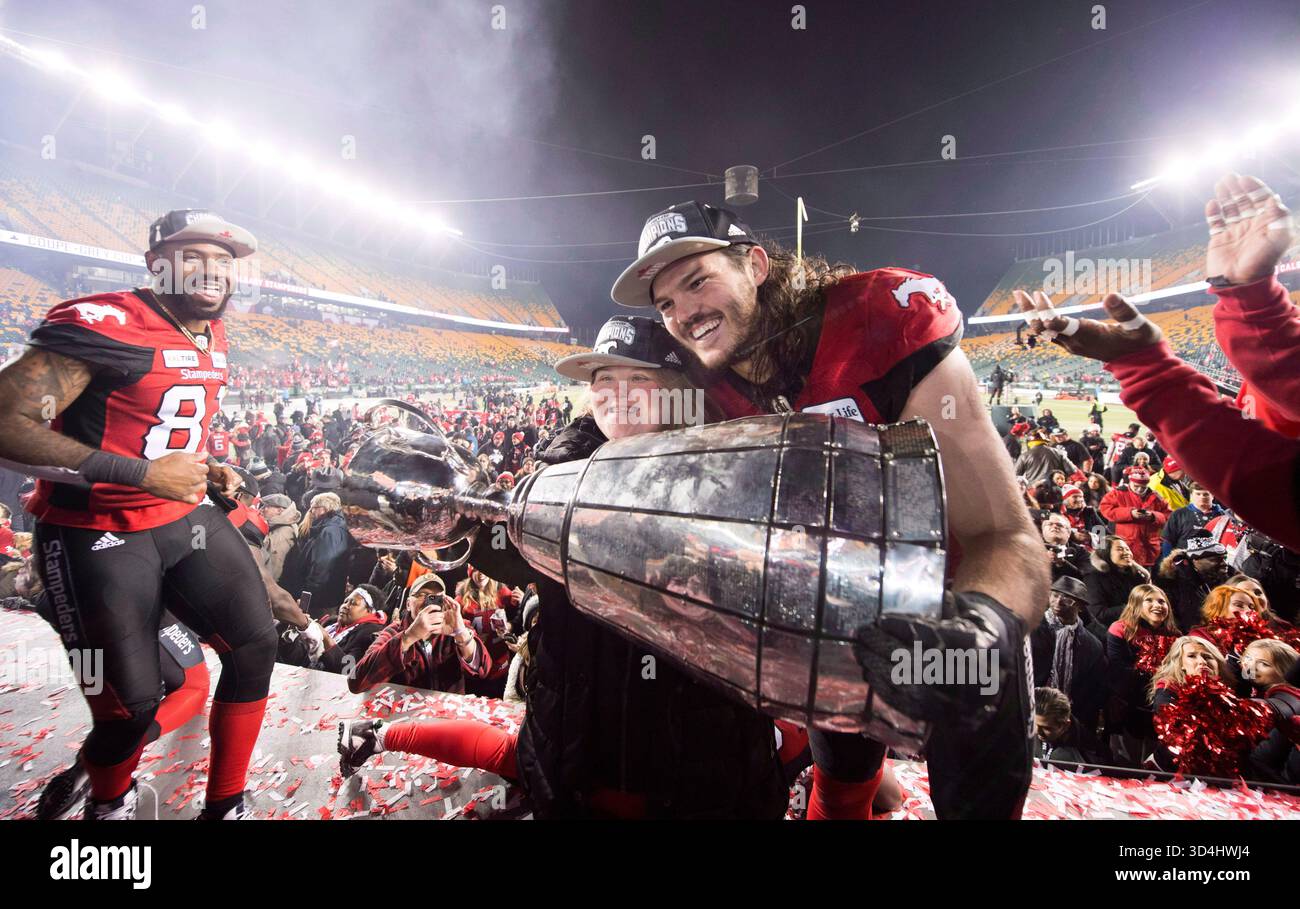 Calgary Stampeders linebacker Alex Singleton (49) holds the Grey Cup ...