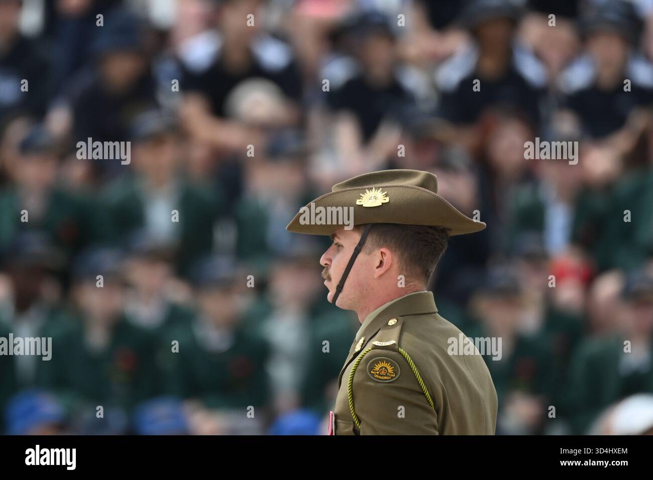 A member of the Catafalque Party mounts the Stone of Remembrance during ...