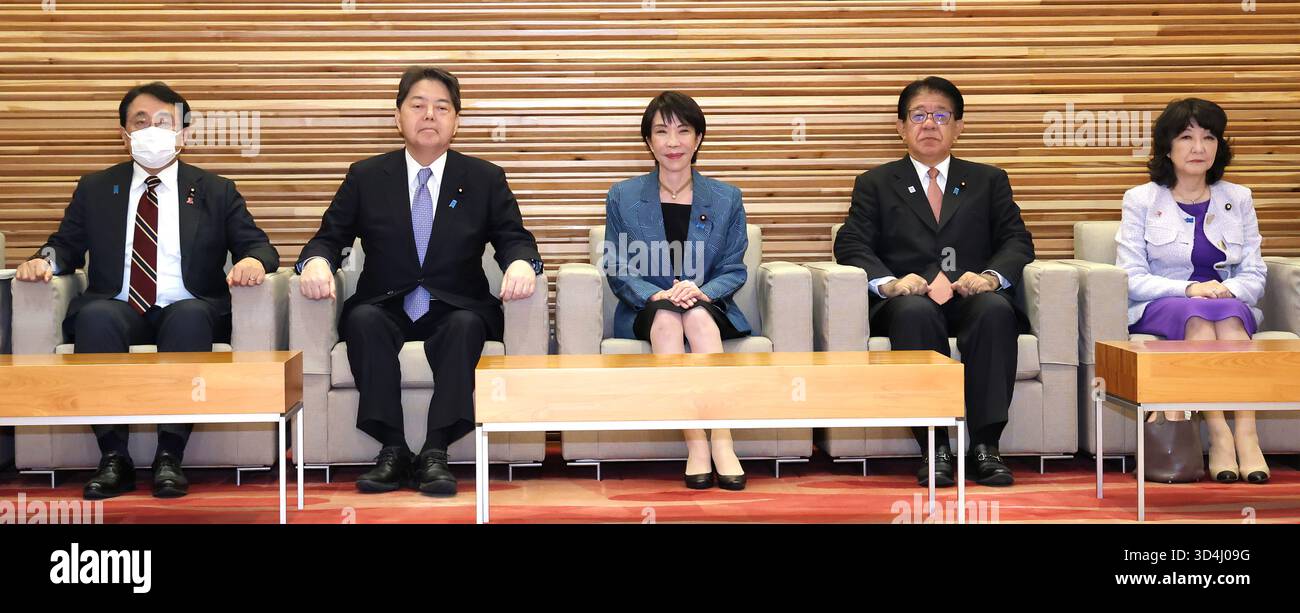 Japanese Prime Minister Sanae Takaichi (C) attends a cabinet meeting at ...