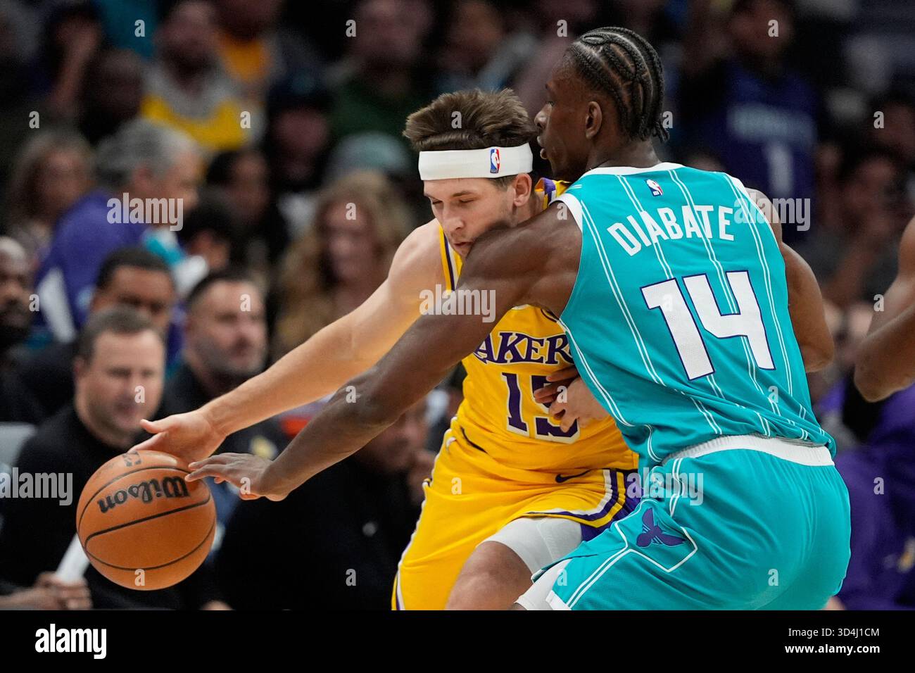 Charlotte Hornets forward Moussa Diabate fouls Los Angeles Lakers guard ...