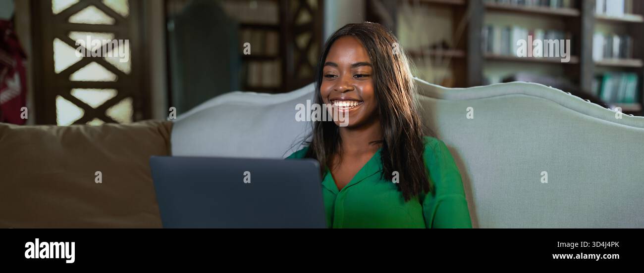 Young Woman Enjoys Online Activity While Relaxing at Home in ...