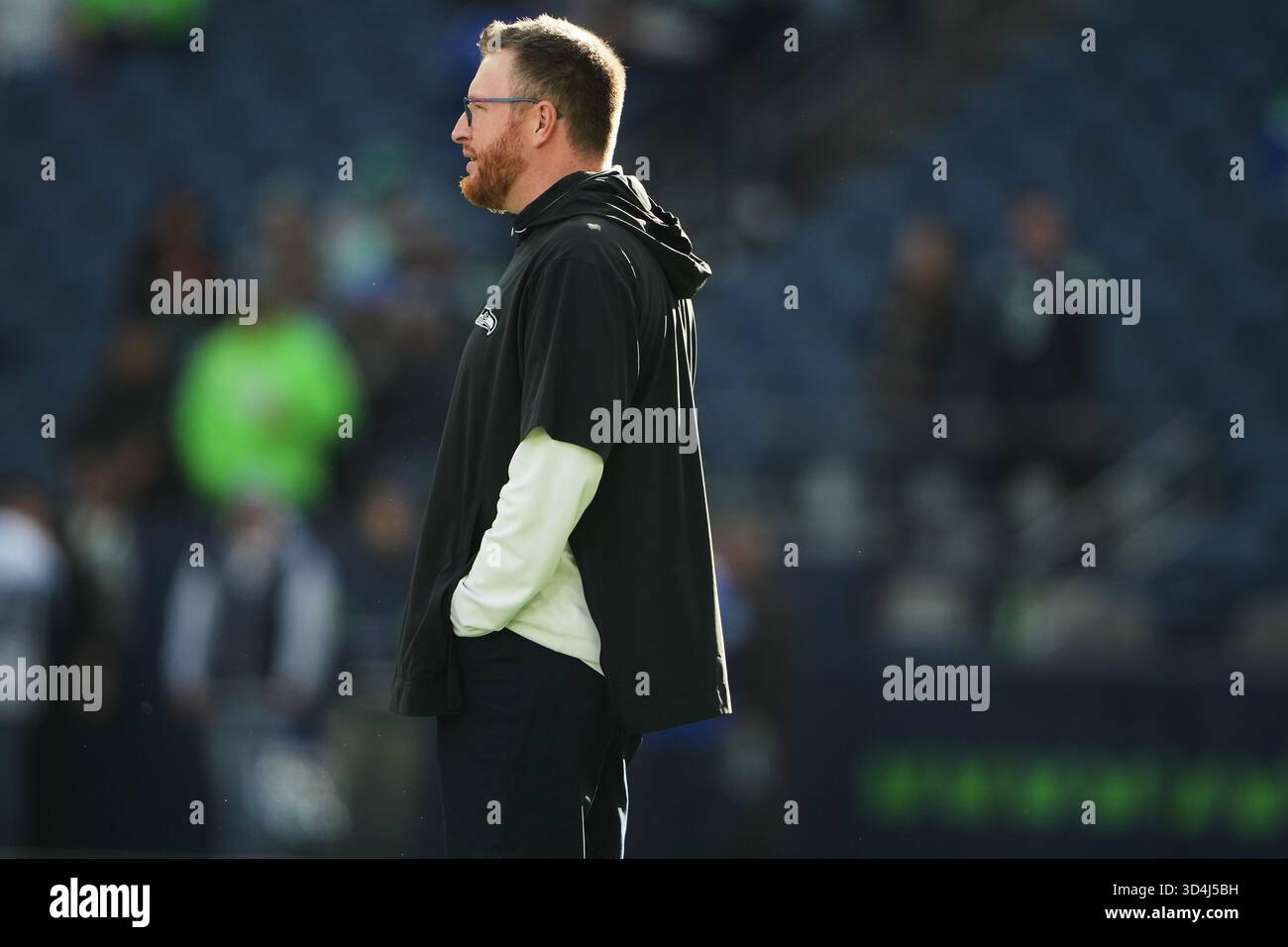 Seattle Seahawks special teams coordinator Jay Harbaugh watches warmups ...