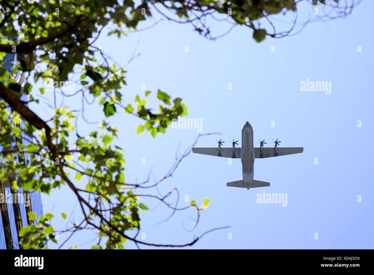 A RAAF aircraft performs a flyover during the Remembrance Day Service ...
