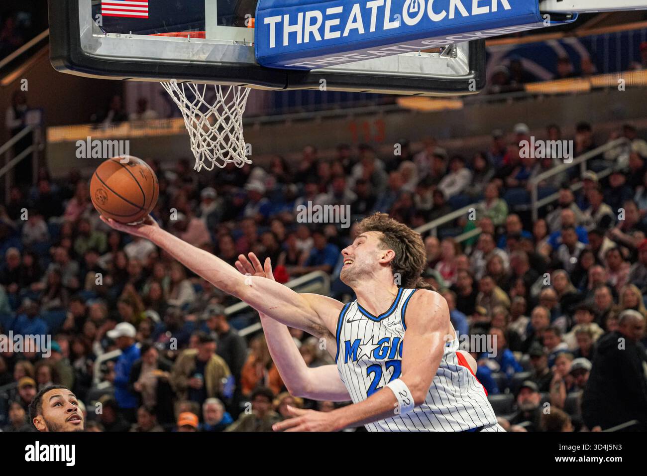 Orlando, Florida, USA, November 10, 2025, Orlando Magic forward Franz Wagner #22 attempt to ...