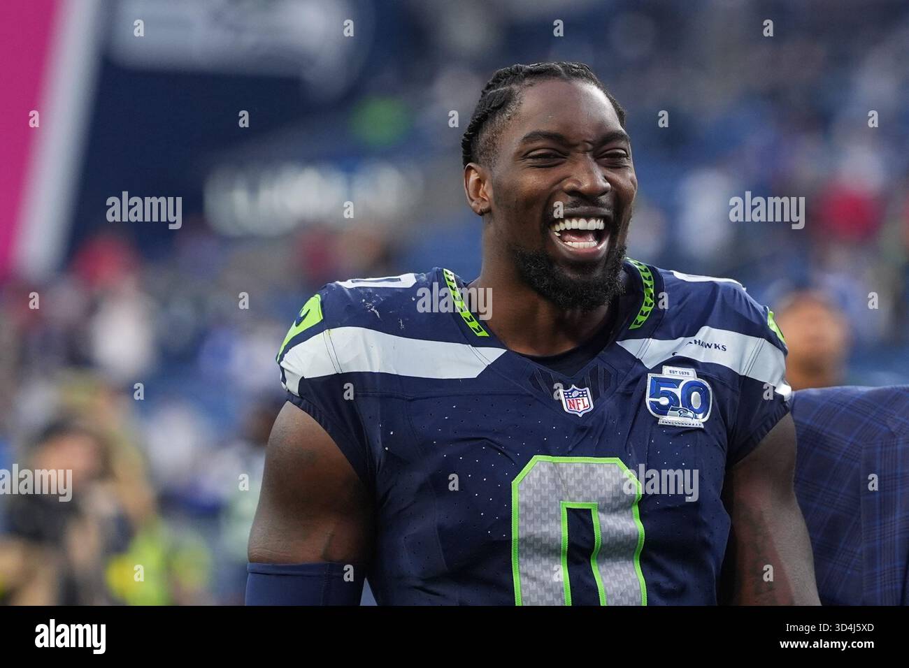 Seattle Seahawks defensive end DeMarcus Lawrence smiles after an NFL ...
