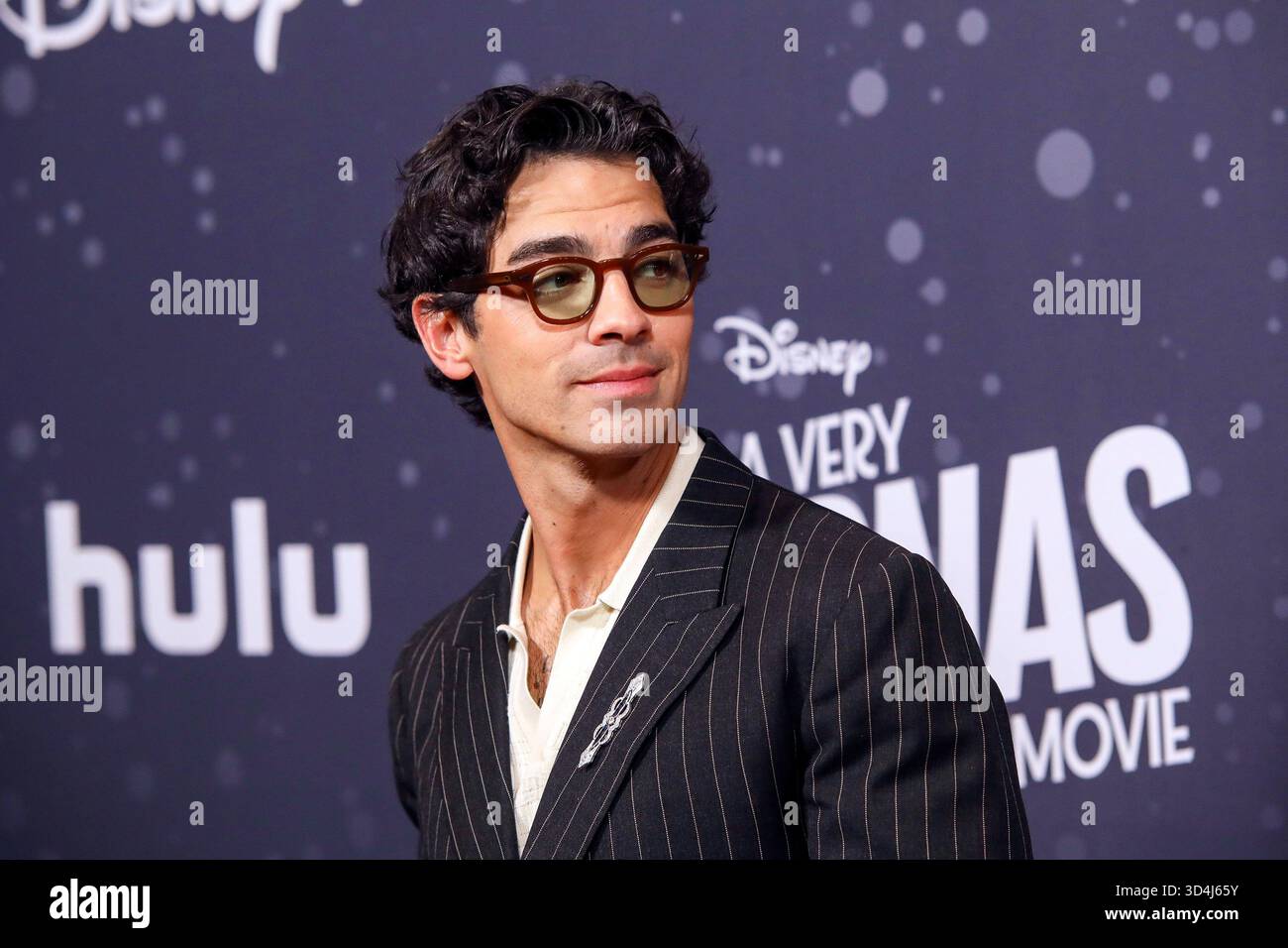 Joe Jonas attends the Disney+ premiere of "A Very Jonas Christmas Movie ...