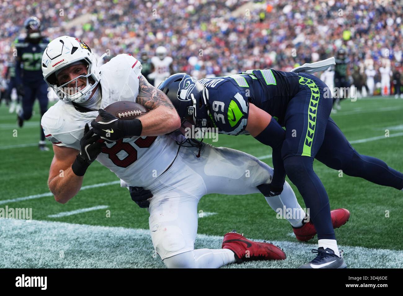 Arizona Cardinals tight end Trey McBride (85) is tackled by Seattle ...