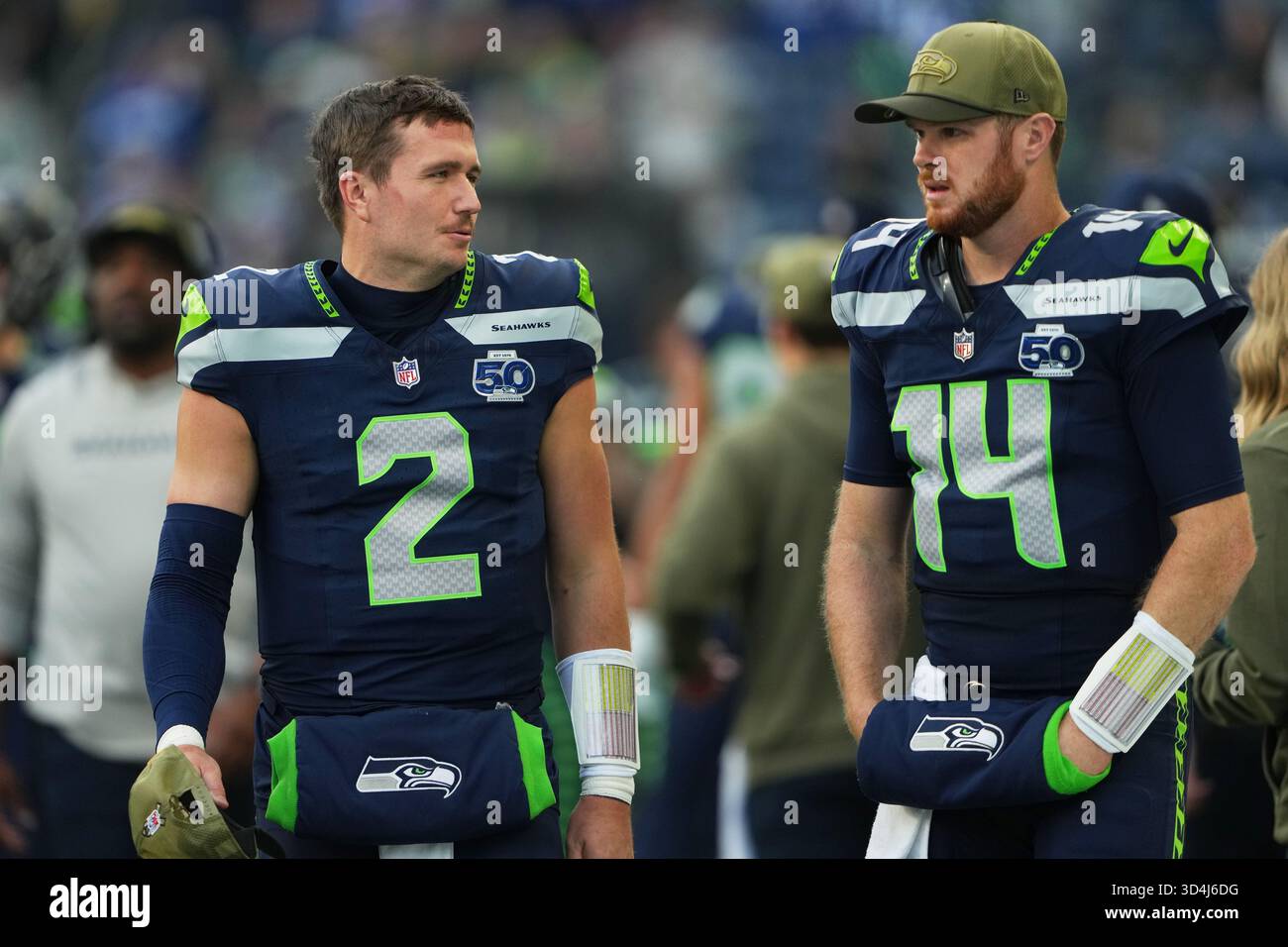 Seattle Seahawks quarterback Drew Lock (2) talks with quarterback Sam ...